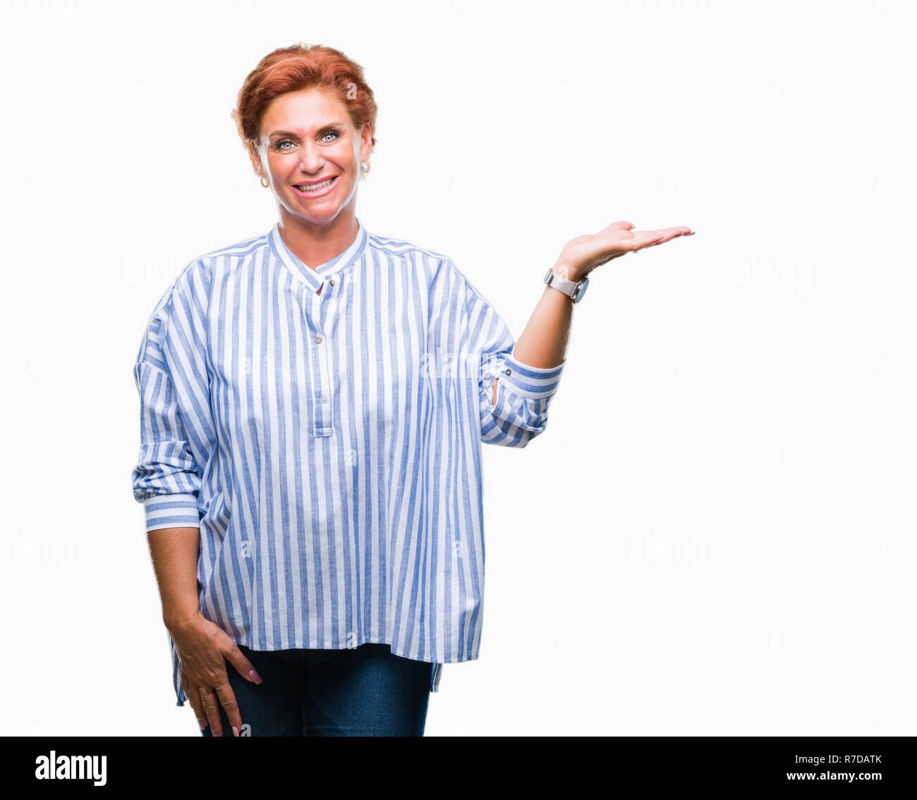 Atrractive senior caucasian redhead woman over isolated background ...
