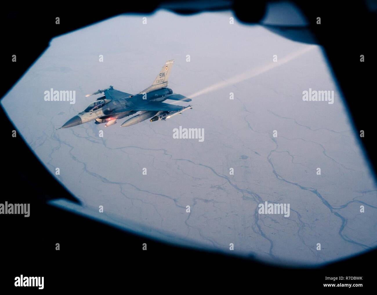 A U.S. Air Force F-16 Fighting Falcon pulls away after being refueled ...