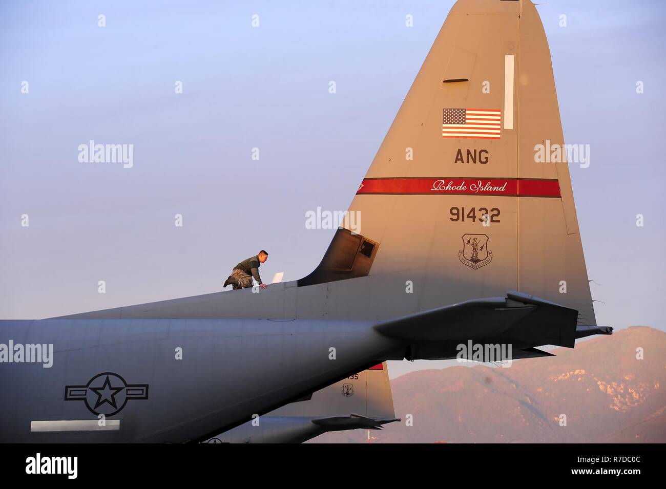 An Airman from 143d Airlift Wing of the Rhode Island Air Guard unit ...