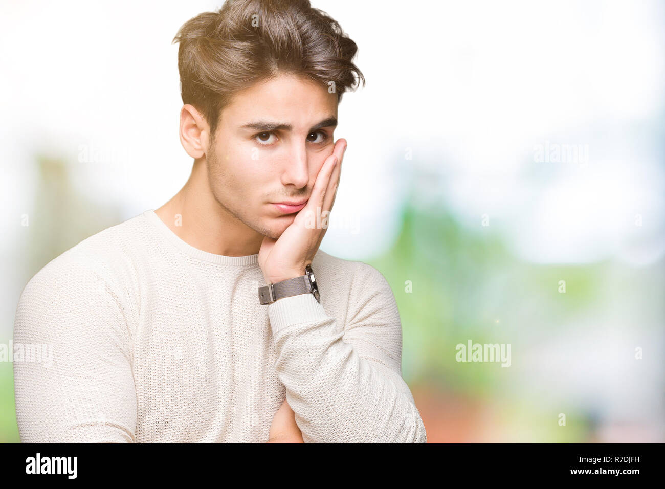 Young handsome man over isolated background thinking looking tired and ...