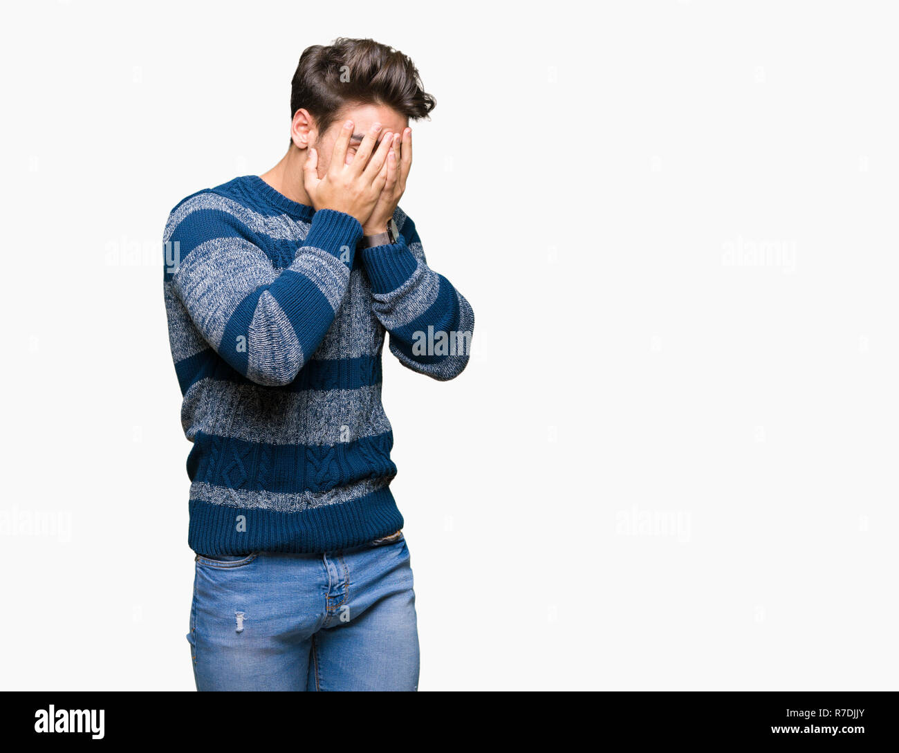 Young handsome man over isolated background with sad expression ...
