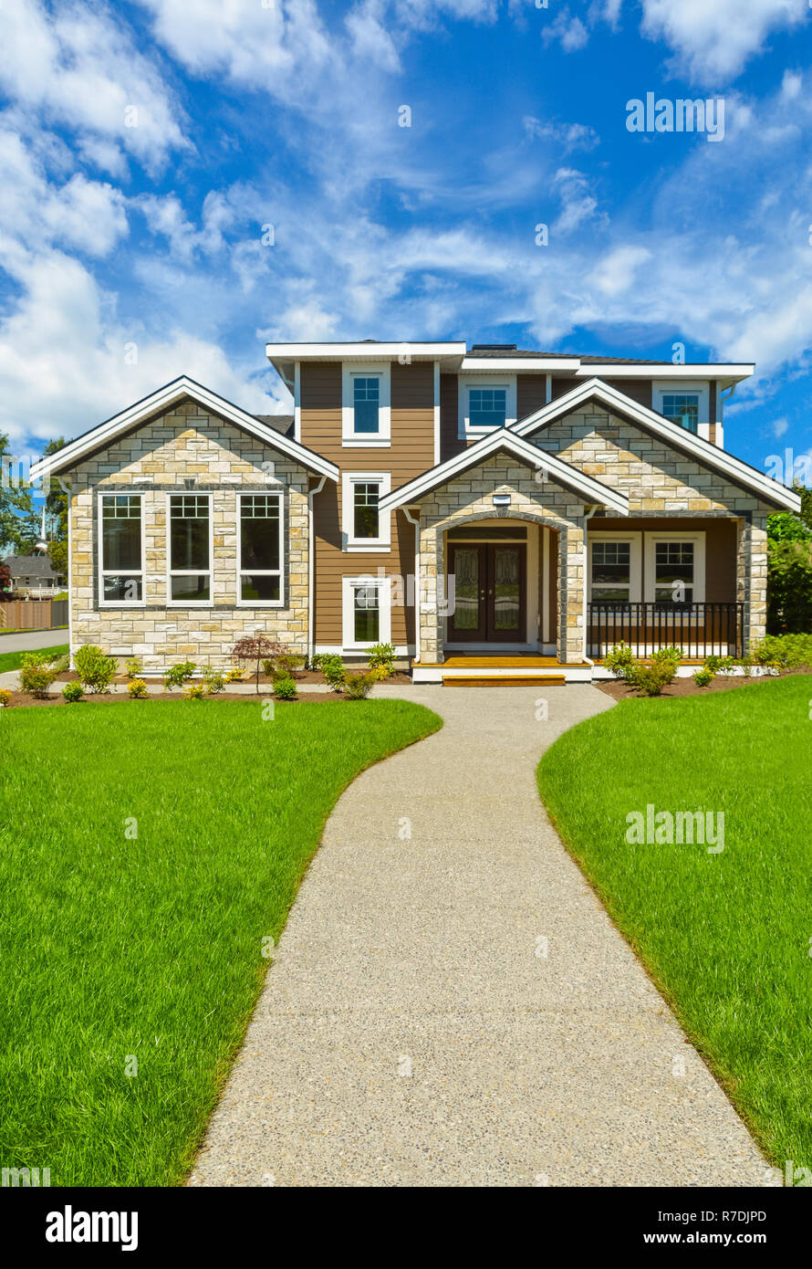 Pathway to ideal family house in perfect neighbourhood on blue sky ...
