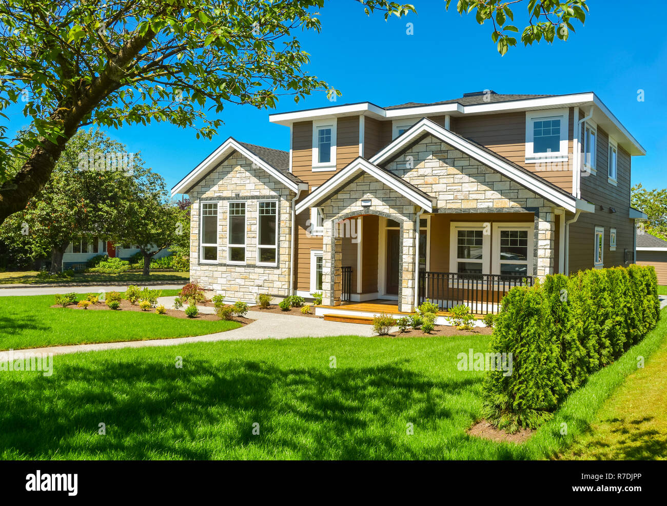 Ideal residential house in perfect neighbourhood on blue sky background ...