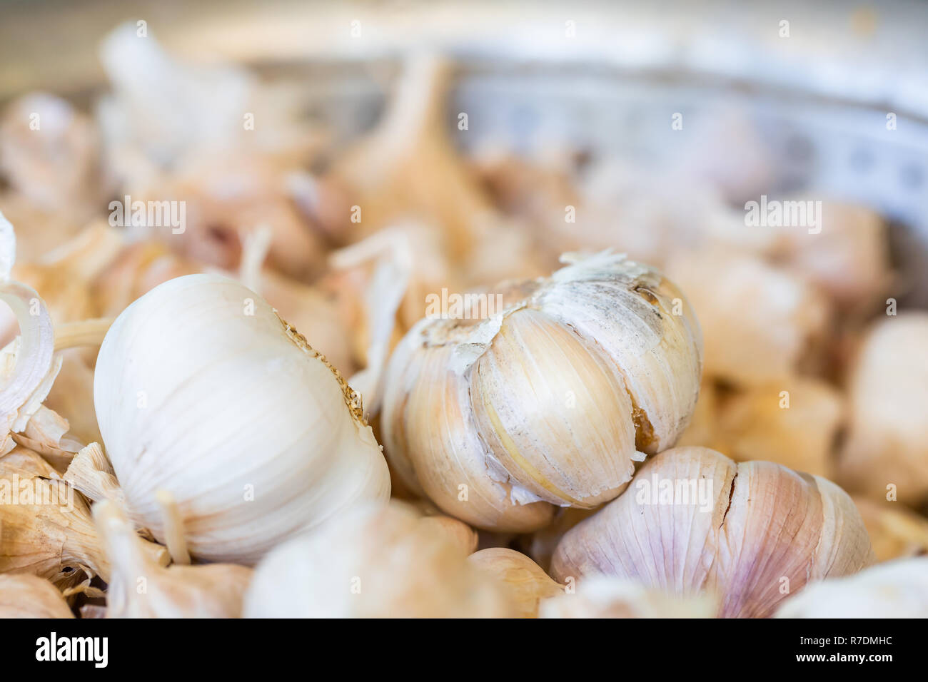 Garlic on cooking utensils in the kitchen Stock Photo - Alamy