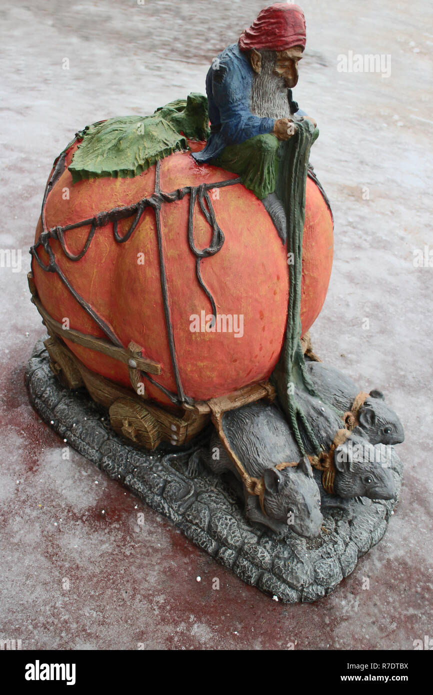 Gnome on a pumpkin ruler of mouse carriage Stock Photo - Alamy