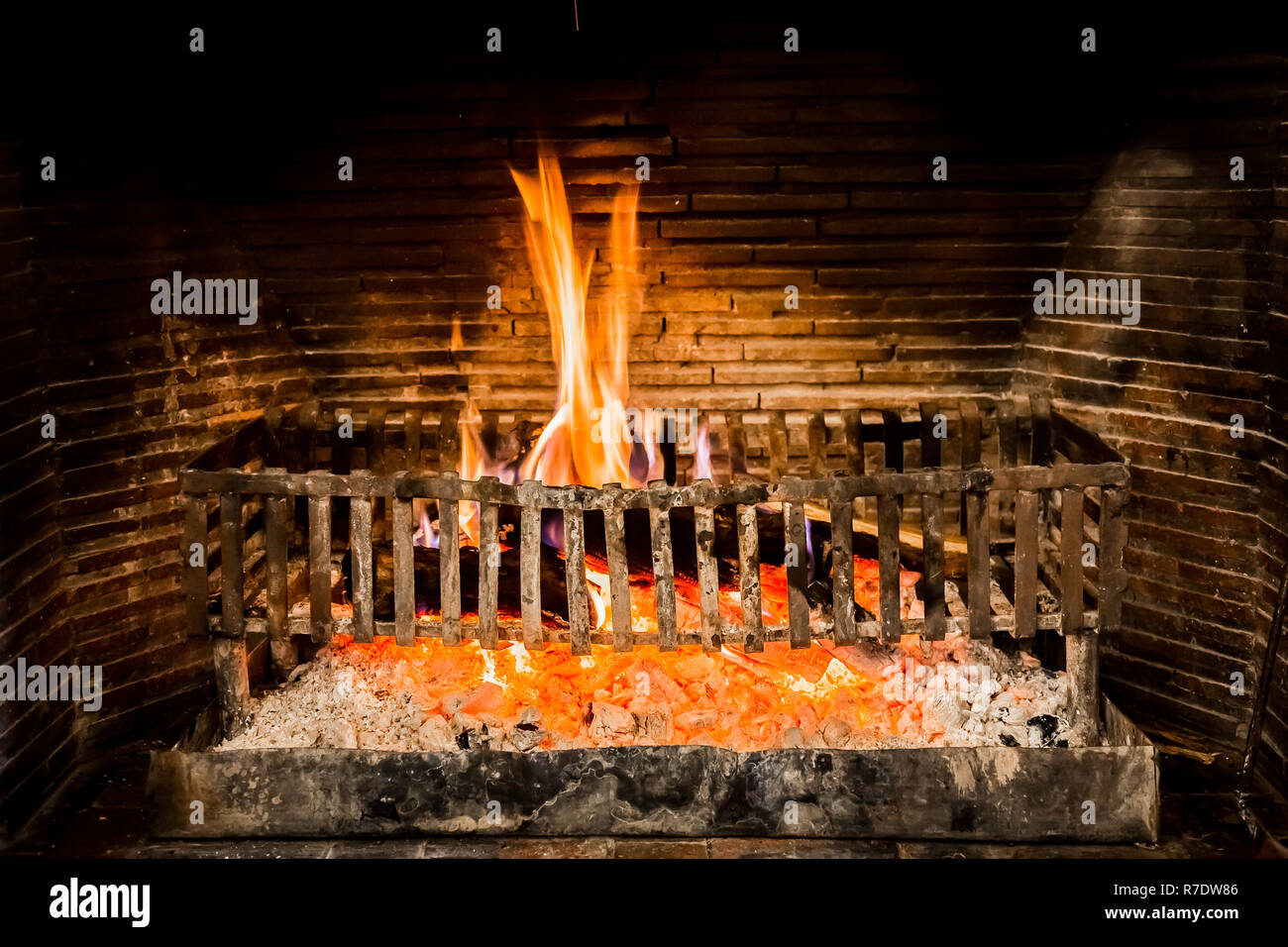 Burning logs in a Winter fireplace Stock Photo - Alamy