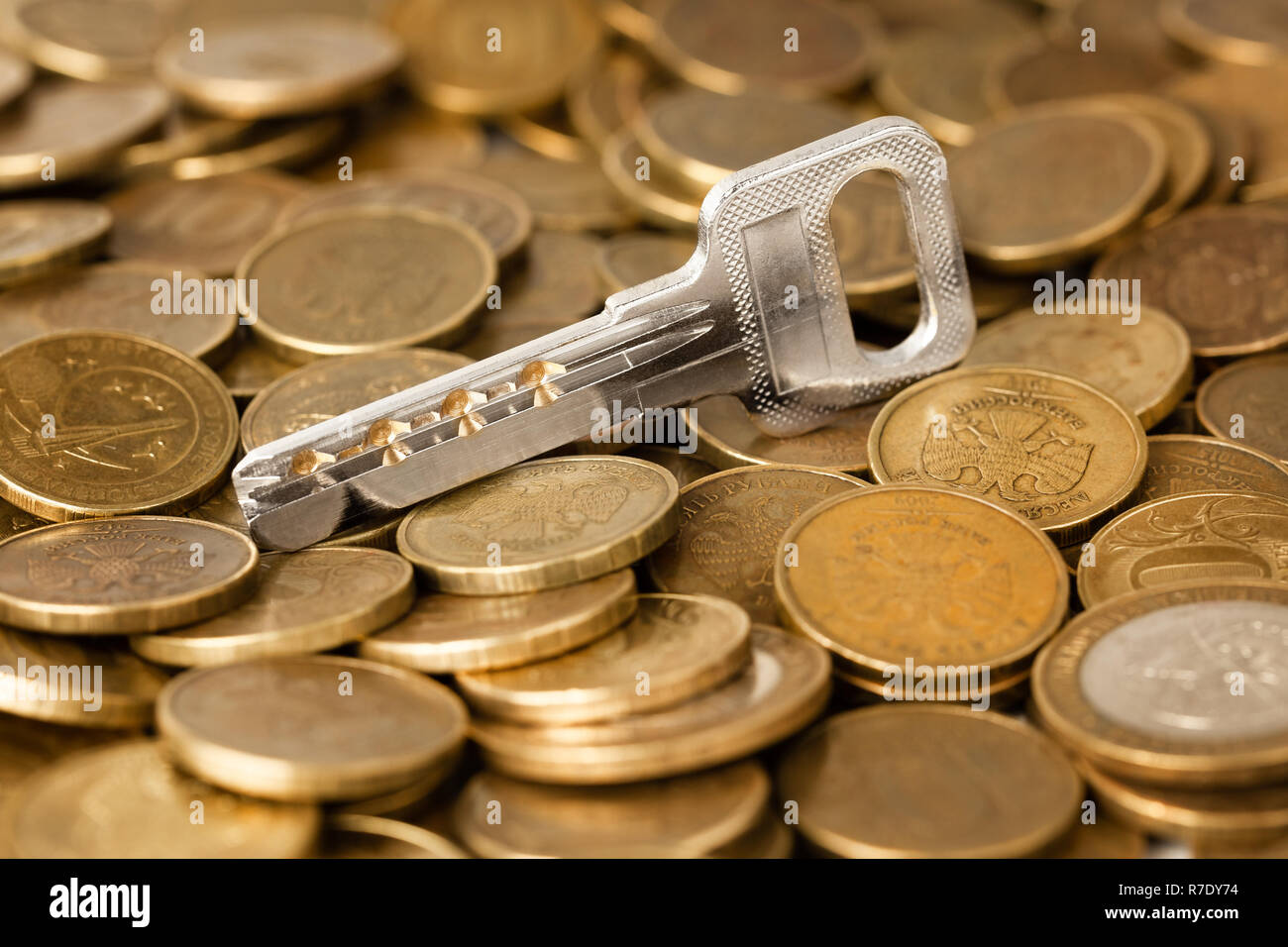 Coins and a key hi-res stock photography and images - Alamy
