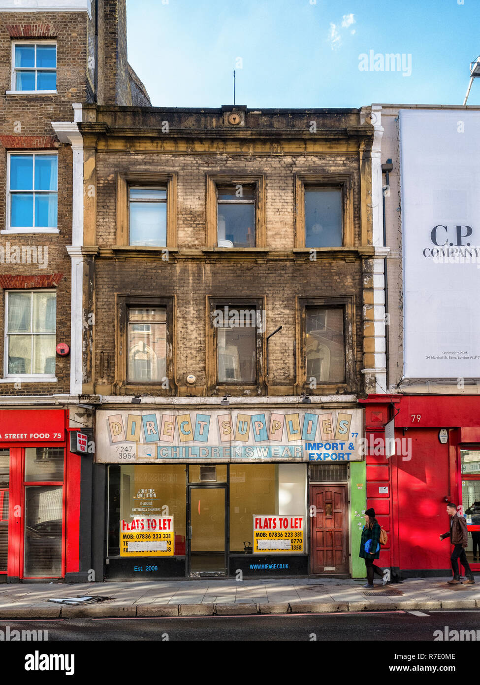 Empty closed shop on Commercial Street in London, on the border of the ...