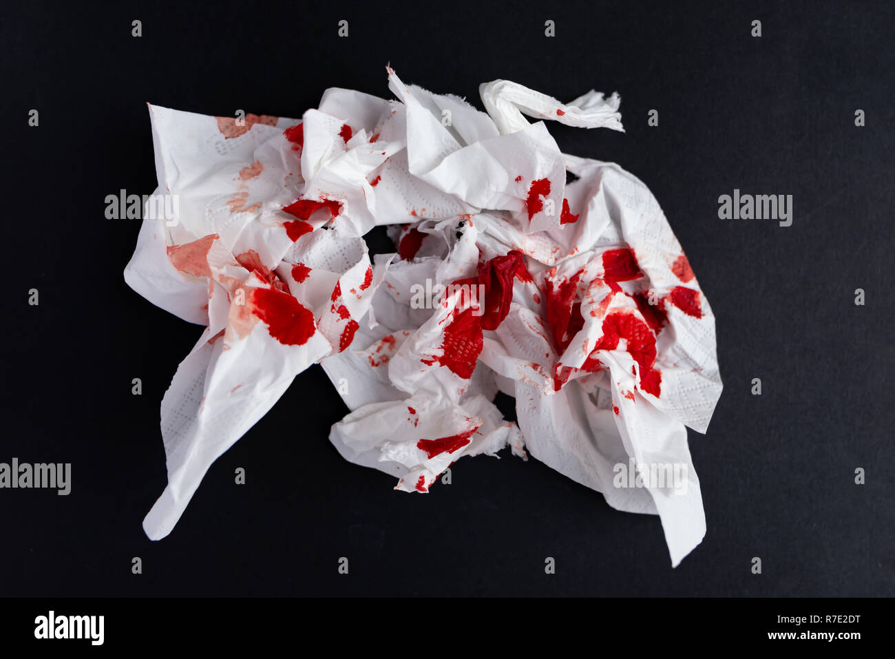 bloody tissue on a black background Stock Photo - Alamy