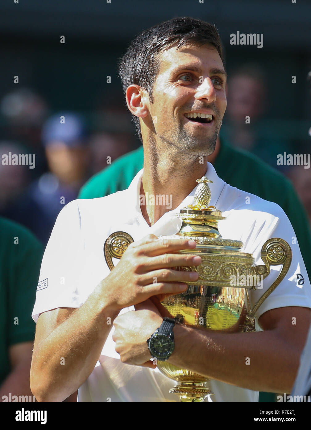 Achievement smiling professional sportsperson standing holding side by ...