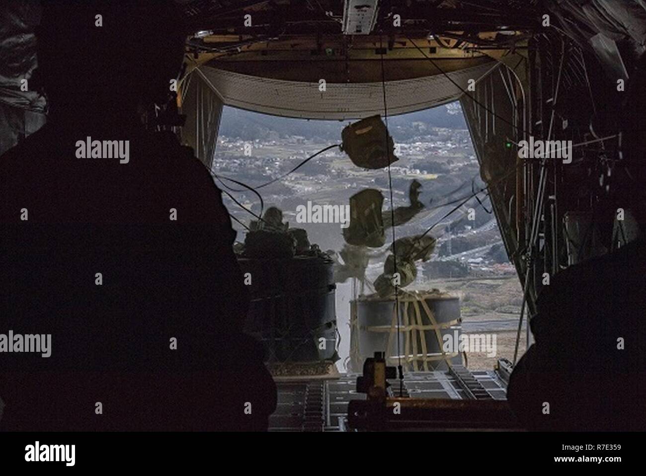 A mass container delivery system bundle drop leaves cargo bay of C-130H ...