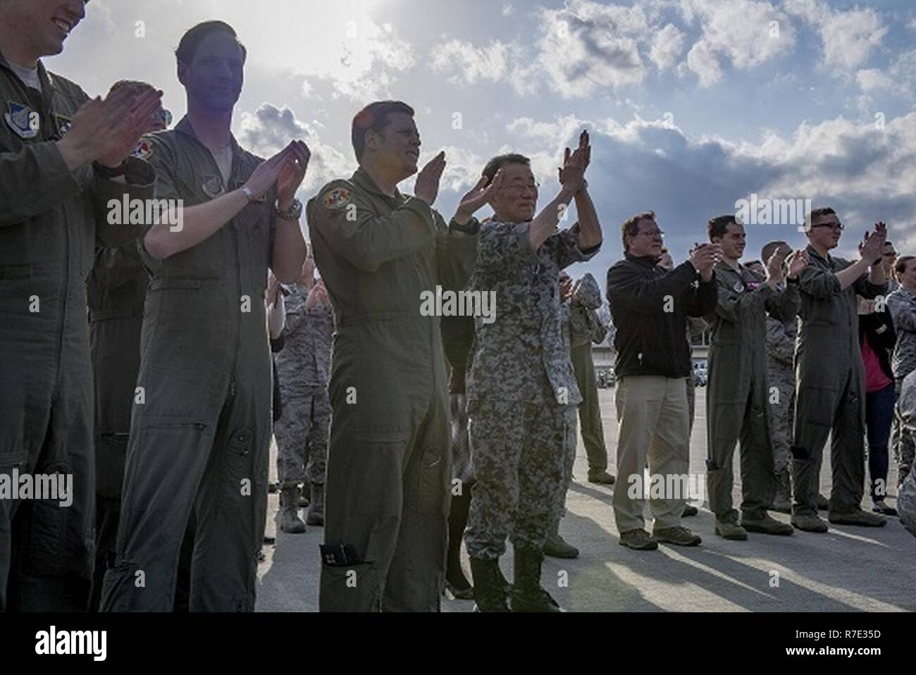 Crowd members applaud for Col. Neil R. Richardson, 374th Airlift Wing ...