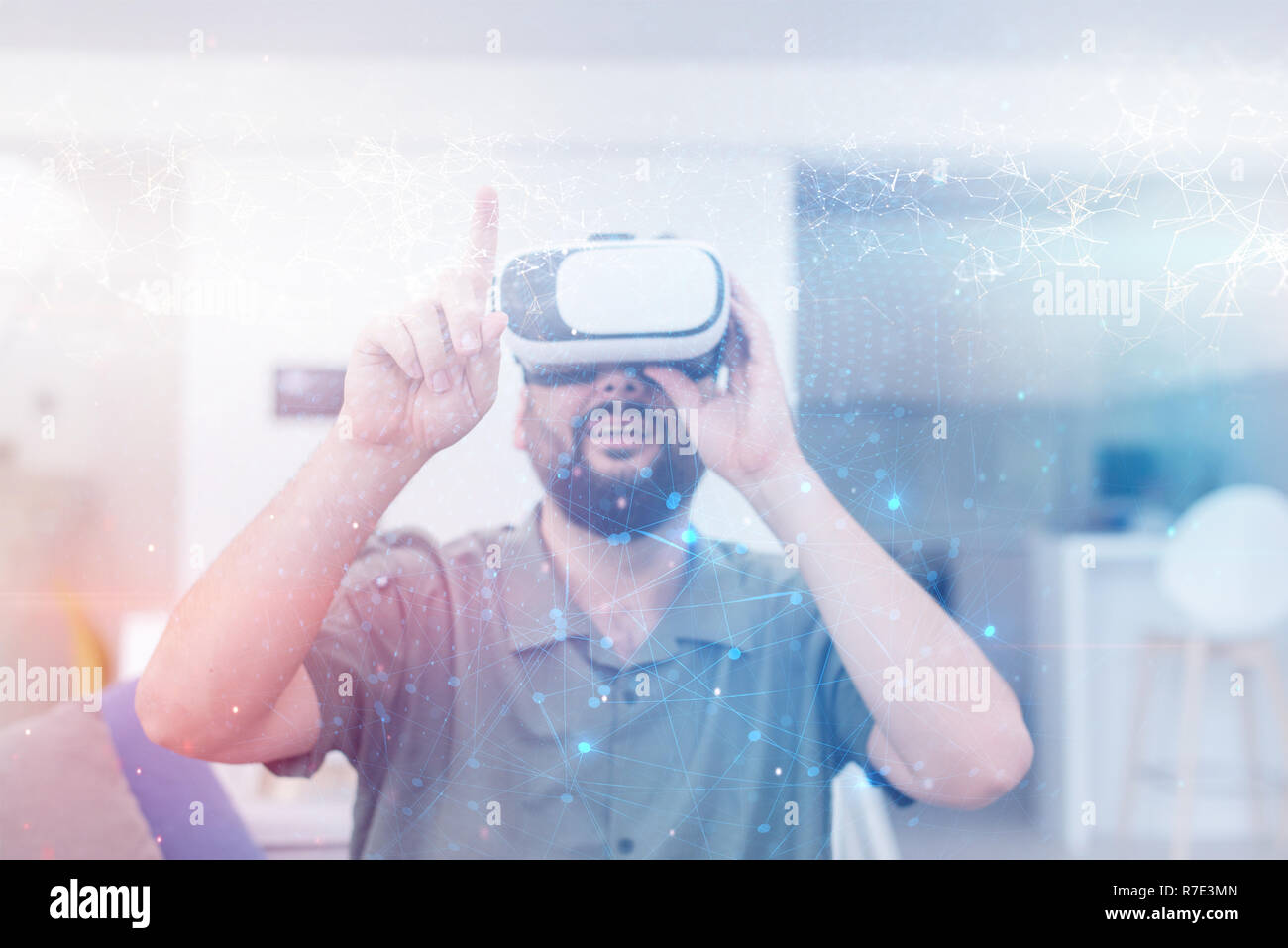 man trying virtual reality vr glasses at modern home with futuristic ...