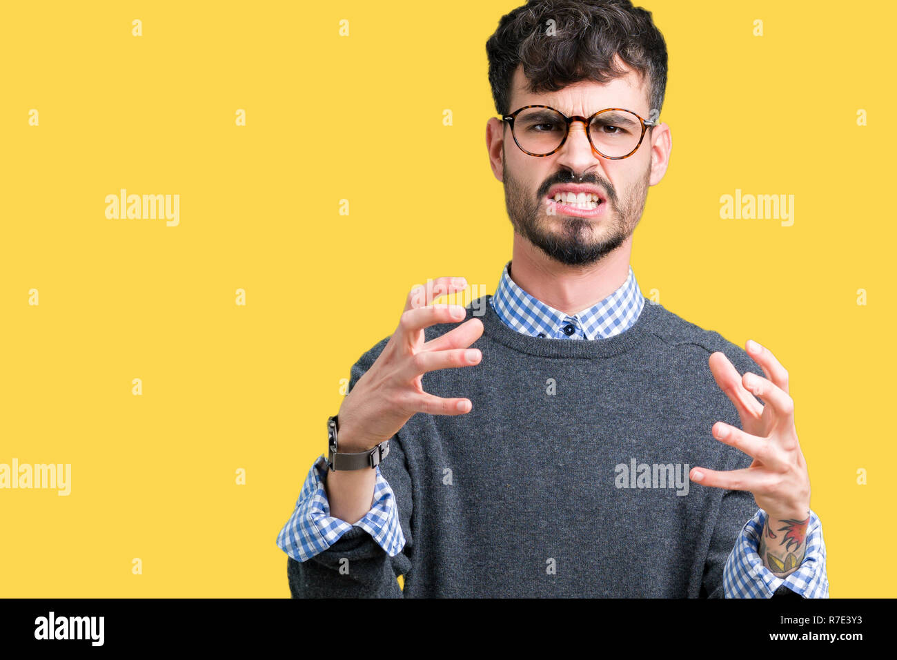 Young handsome smart man wearing glasses over isolated background ...