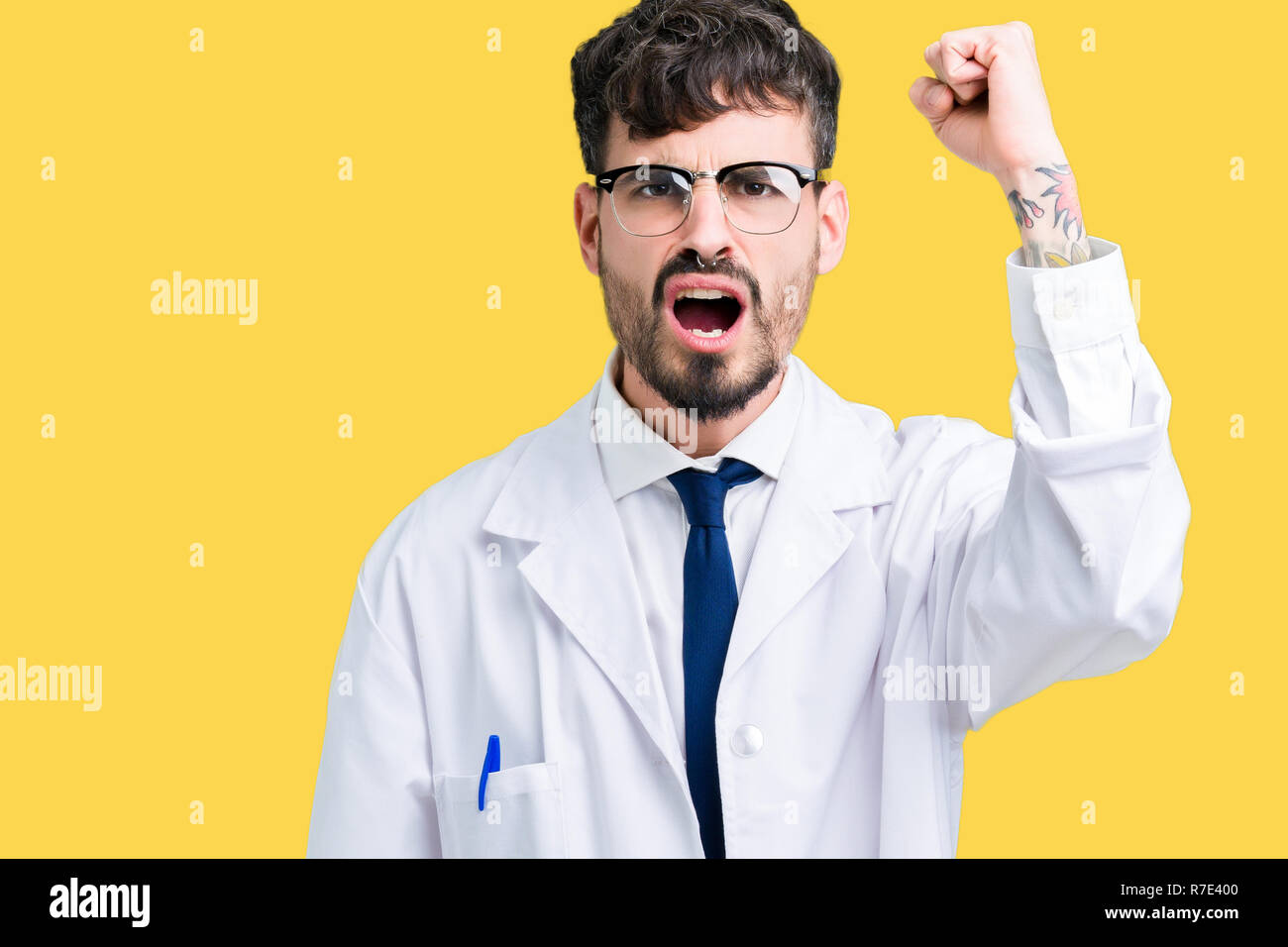Young professional scientist man wearing white coat over isolated ...