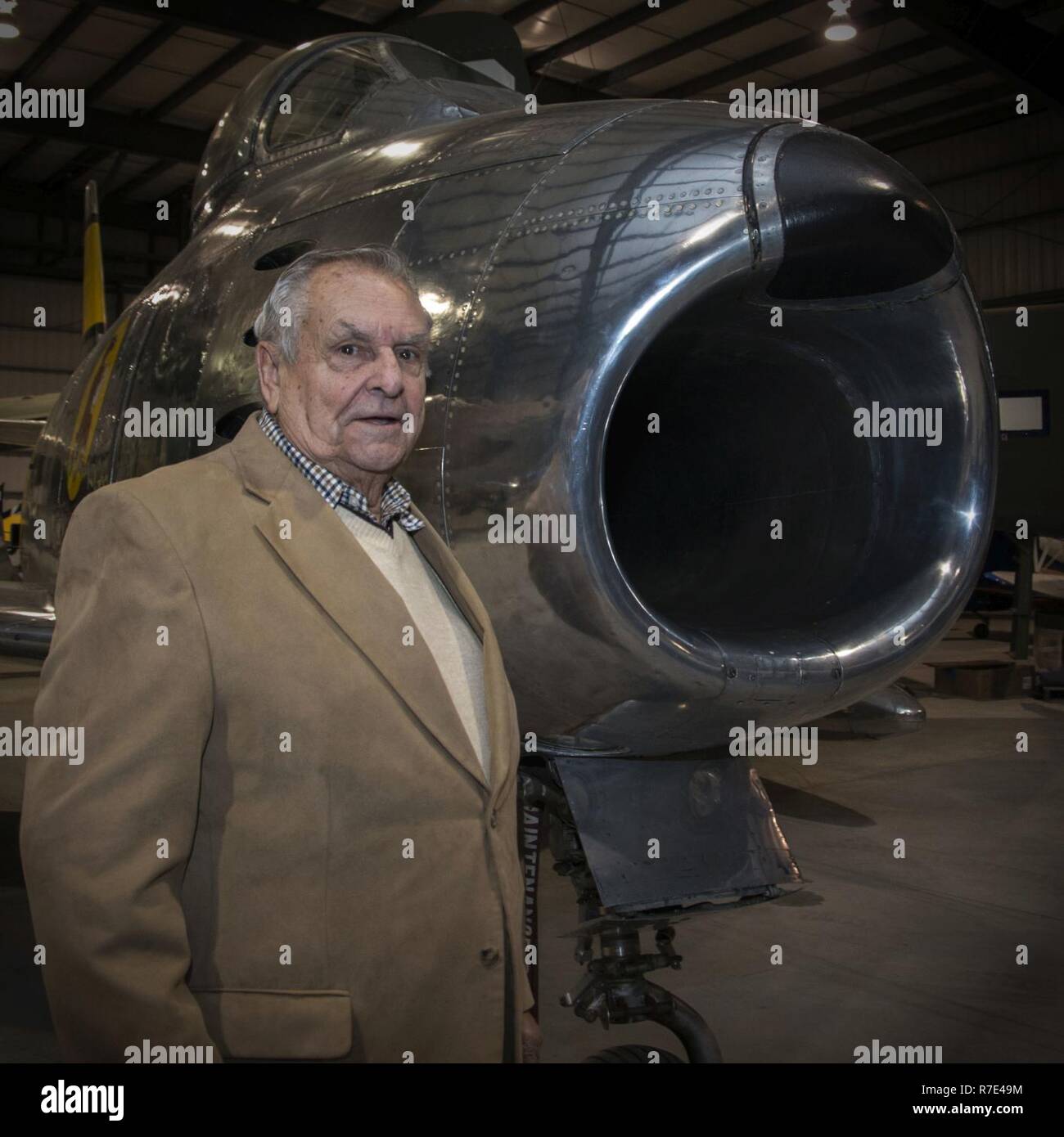 Robert Rawlings, Korean War veteran, stands next to a North American F ...