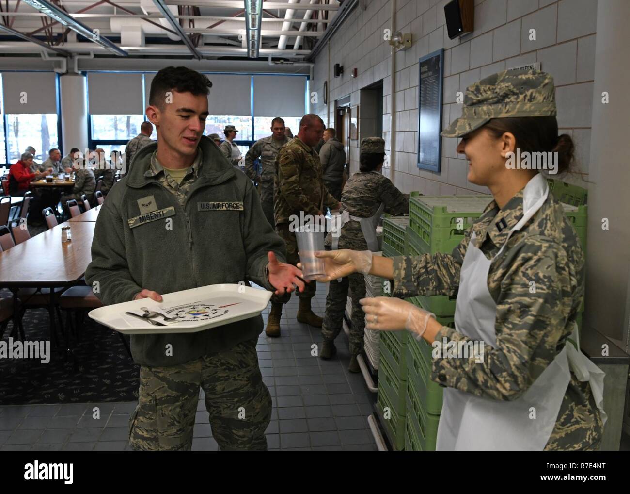 Captain Elizabeth Bieler, 104th Medical Group officer, helps serve ...