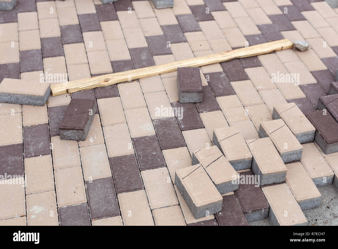 Row of stacks of gray pavement slab on wooden base . Concrete stone ...