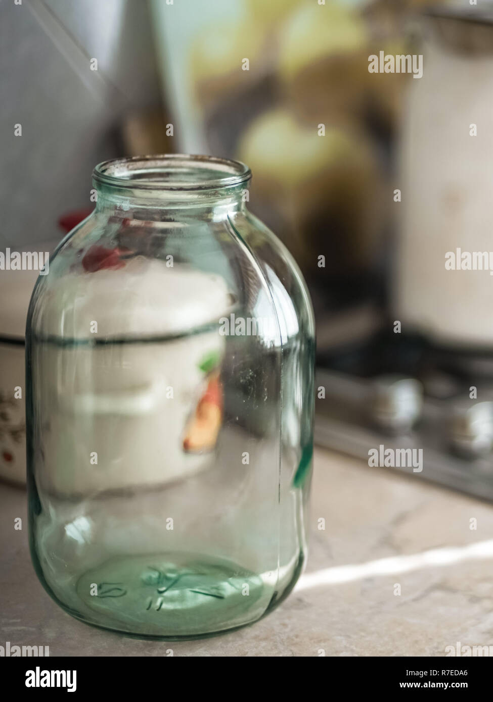 Empty three-liter jar stands on the tabletop Stock Photo - Alamy