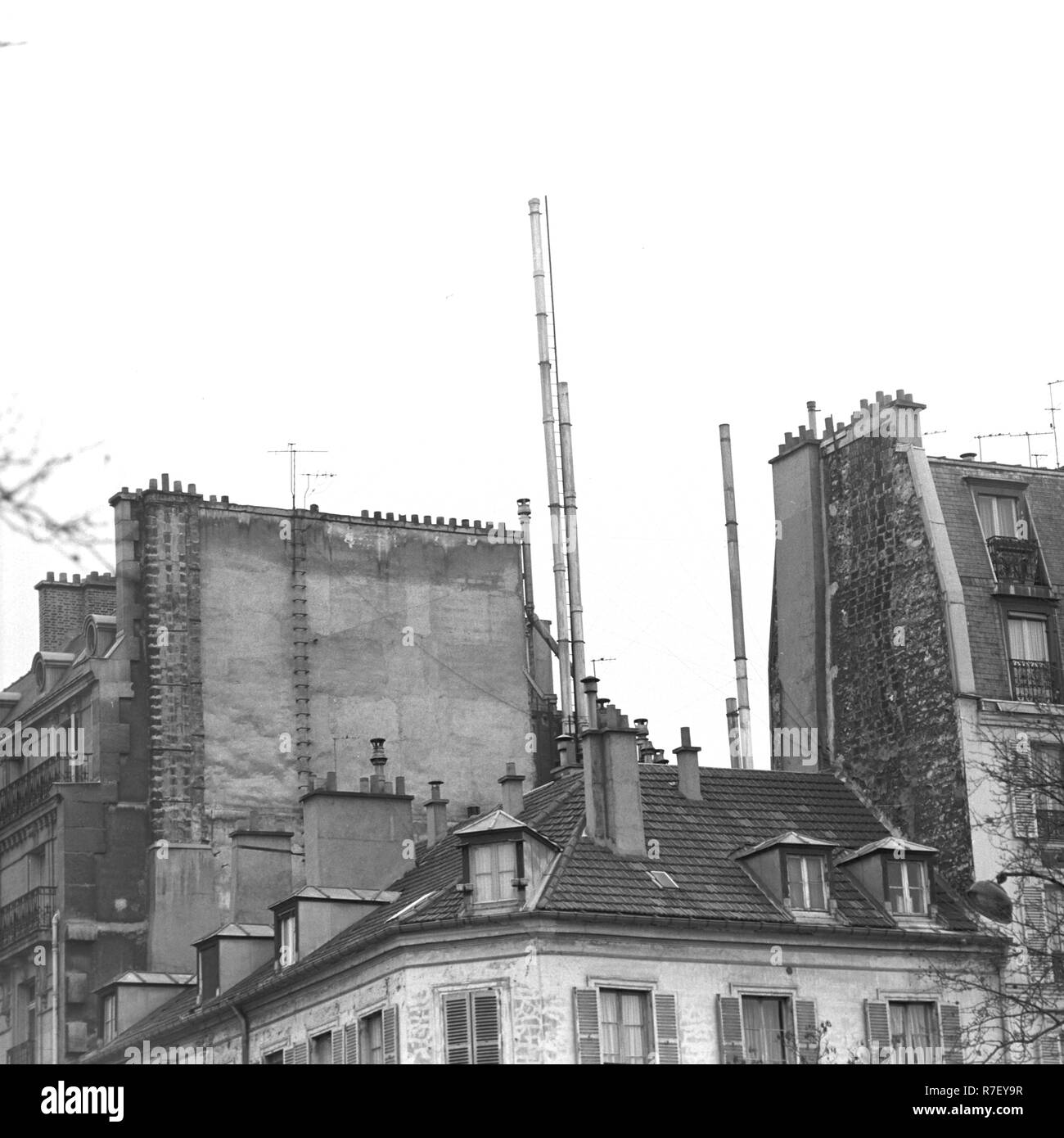 View of the typical chimneys of a residential house in Paris, France ...