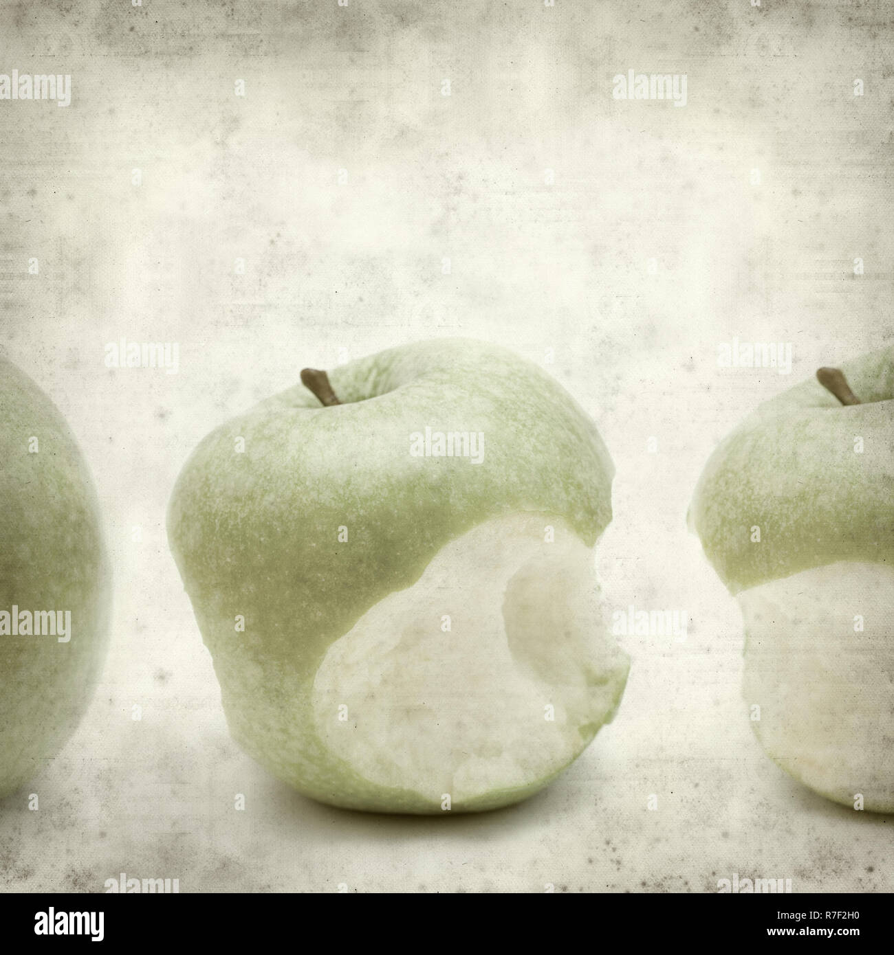 textured old paper background with green apple eating progression Stock ...