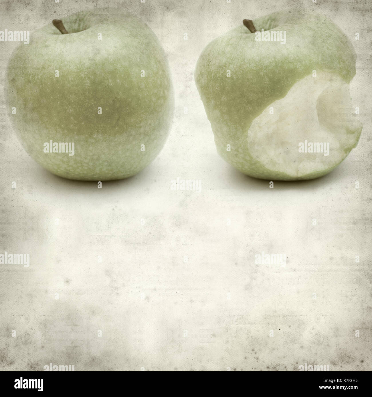 textured old paper background with green apple eating progression Stock ...