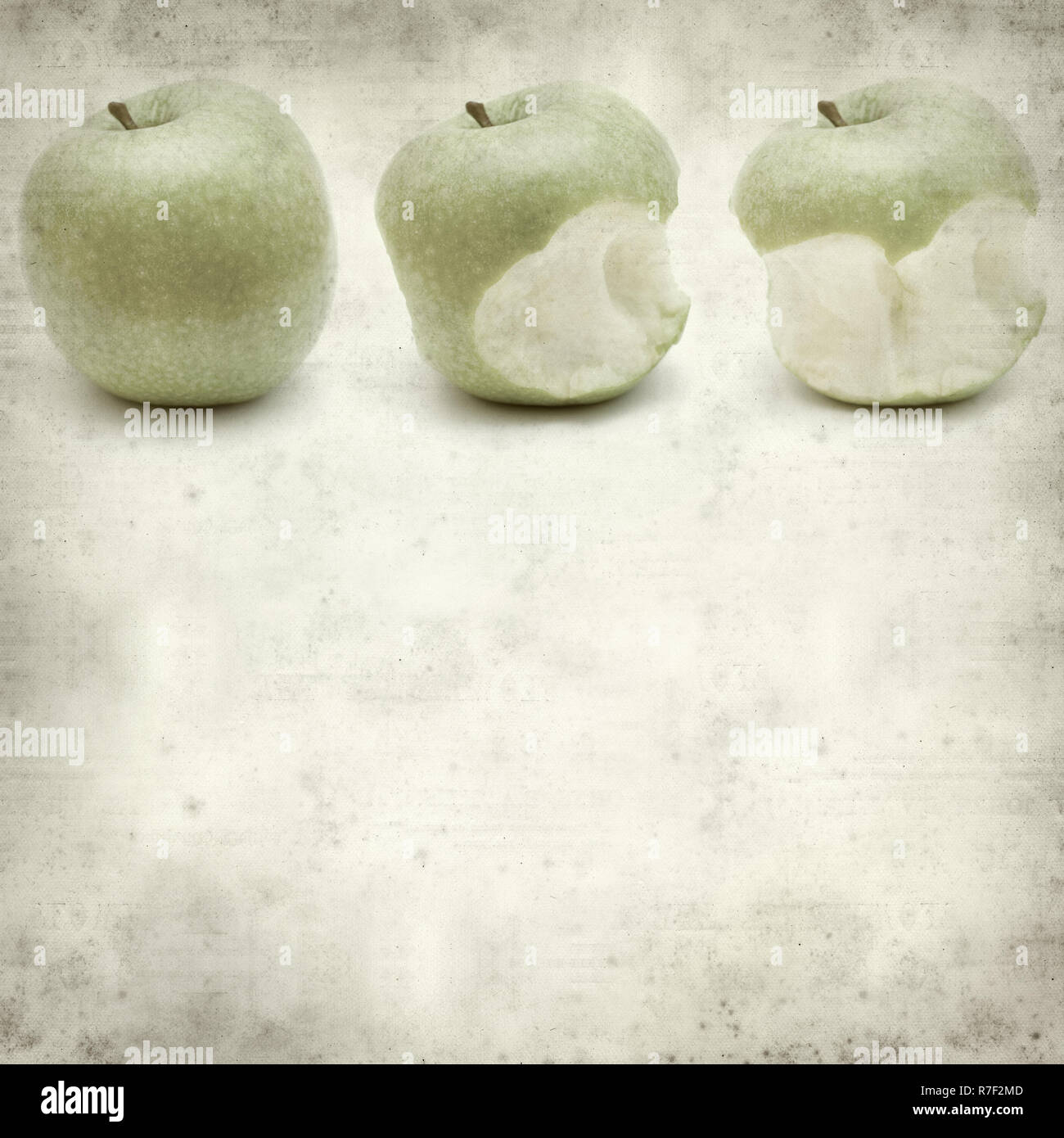 textured old paper background with green apple eating progression Stock ...