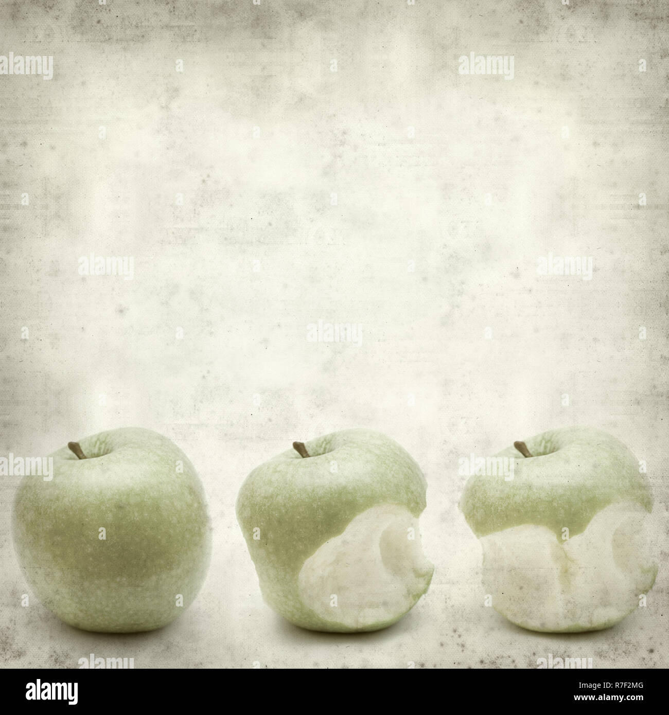 textured old paper background with green apple eating progression Stock ...