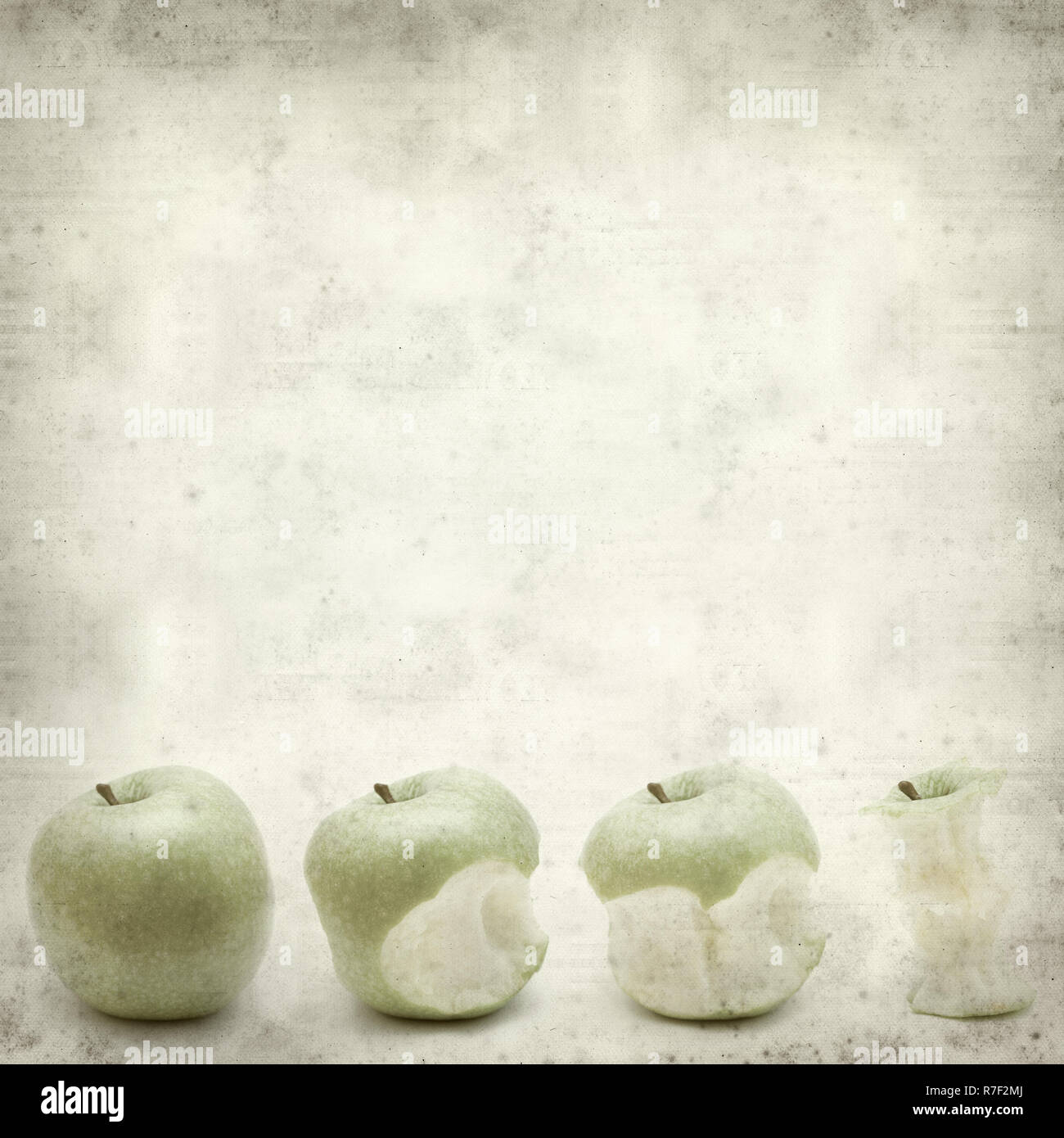 textured old paper background with green apple eating progression Stock ...
