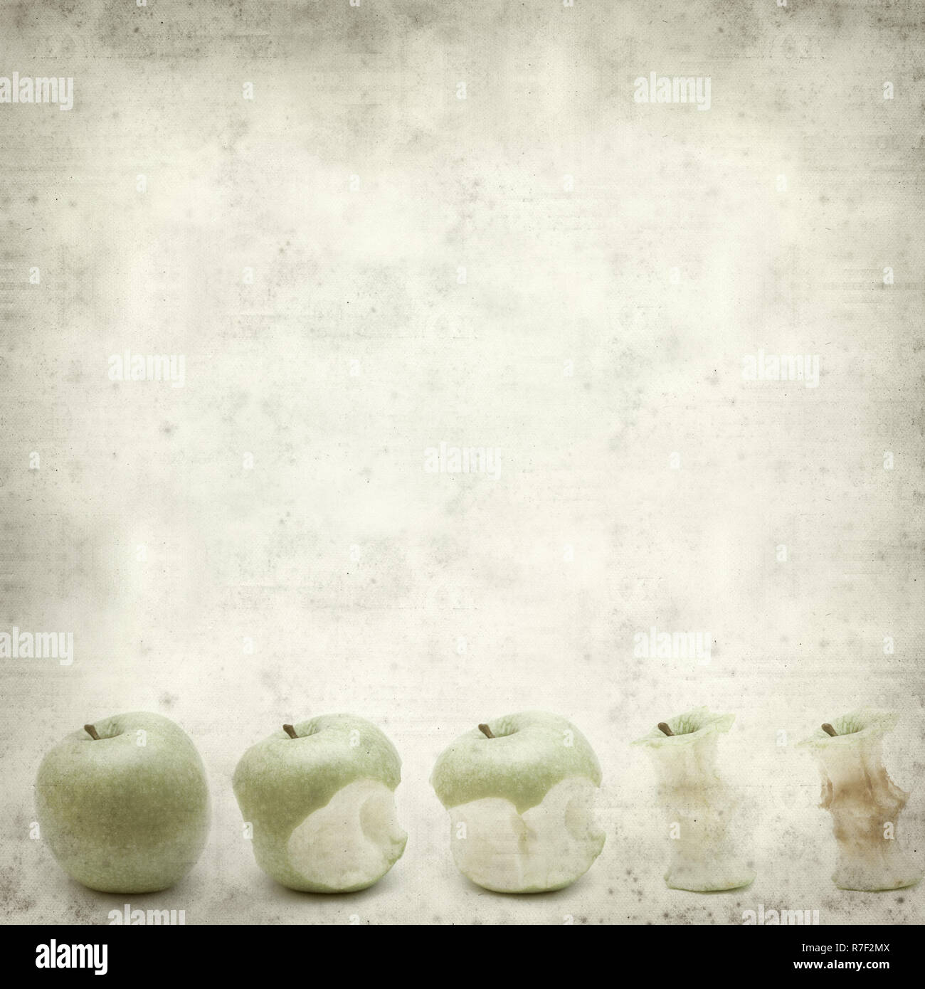 textured old paper background with green apple eating progression Stock ...