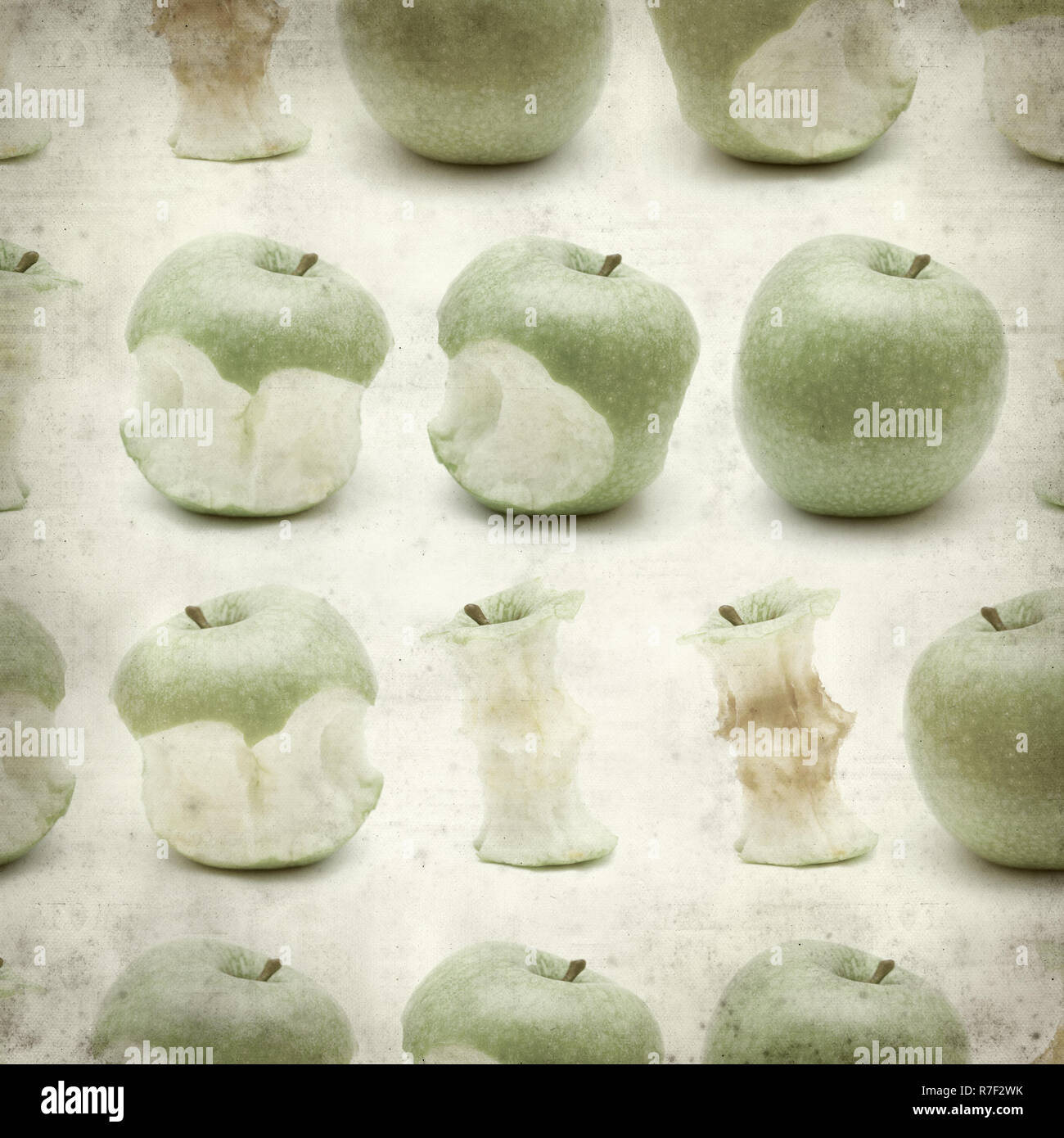 textured old paper background with green apple eating progression Stock ...