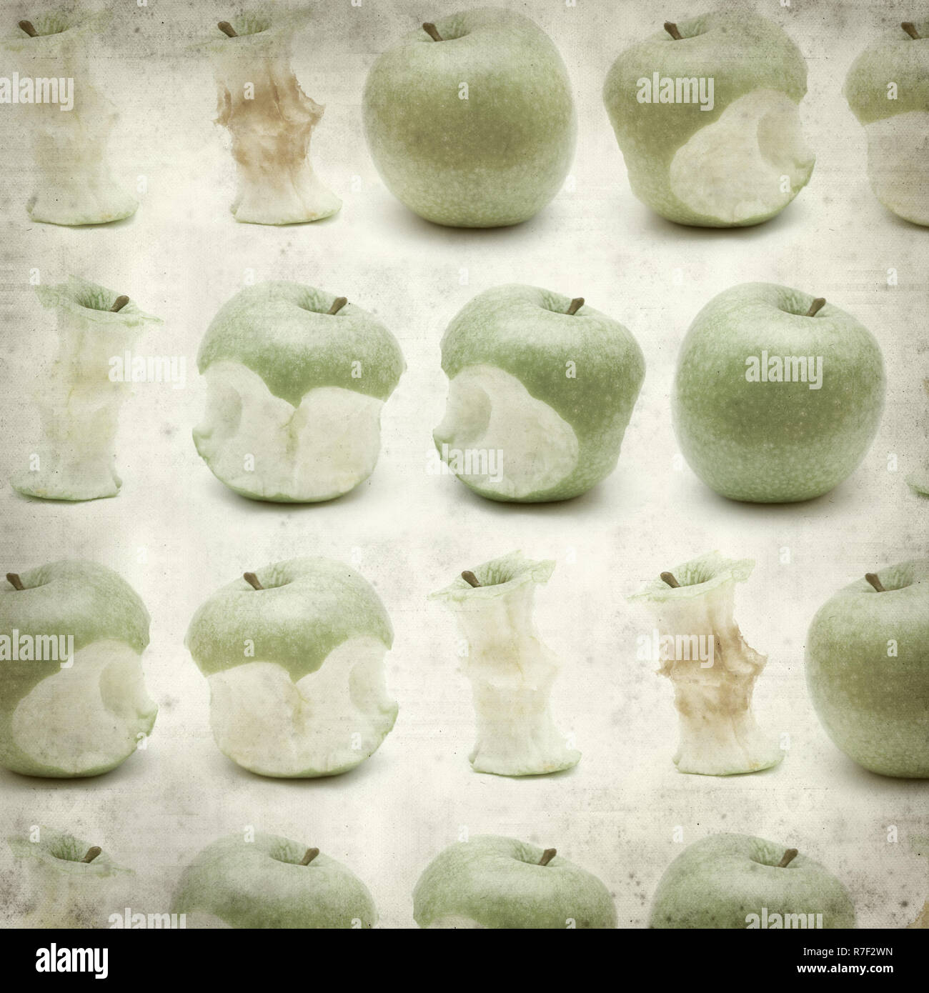 textured old paper background with green apple eating progression Stock ...