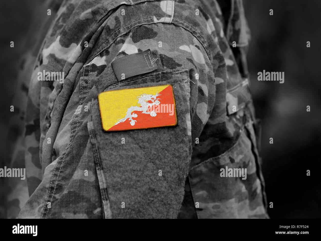 Flag of Bhutan on soldiers arm. Flag of Bhutan on military uniforms ...