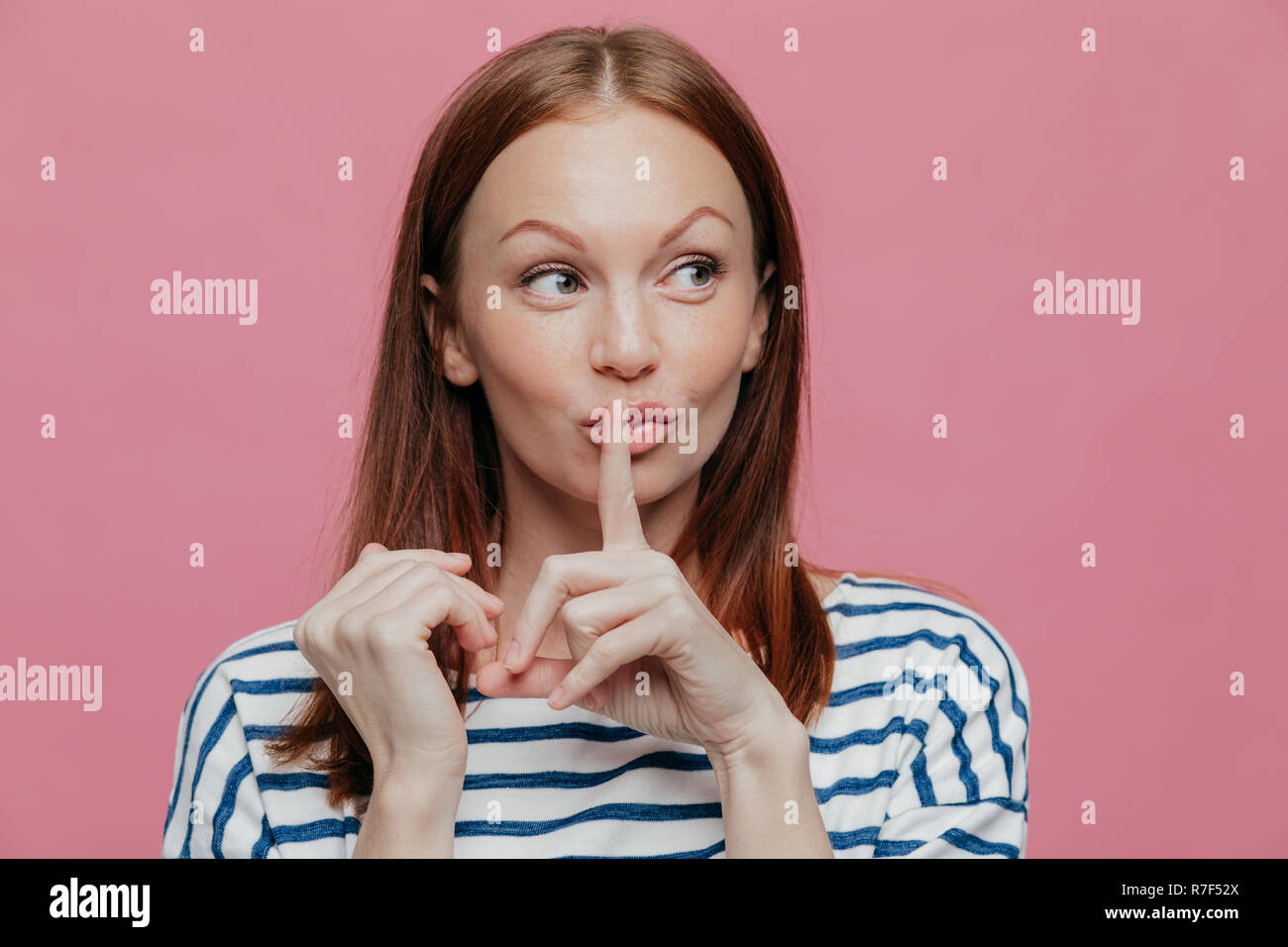 Finger over mouth hi-res stock photography and images - Alamy