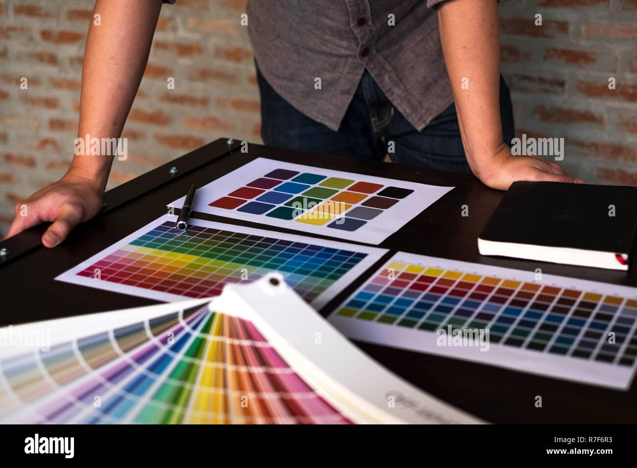 Graphic designers choose colors from the color bands samples for design ...