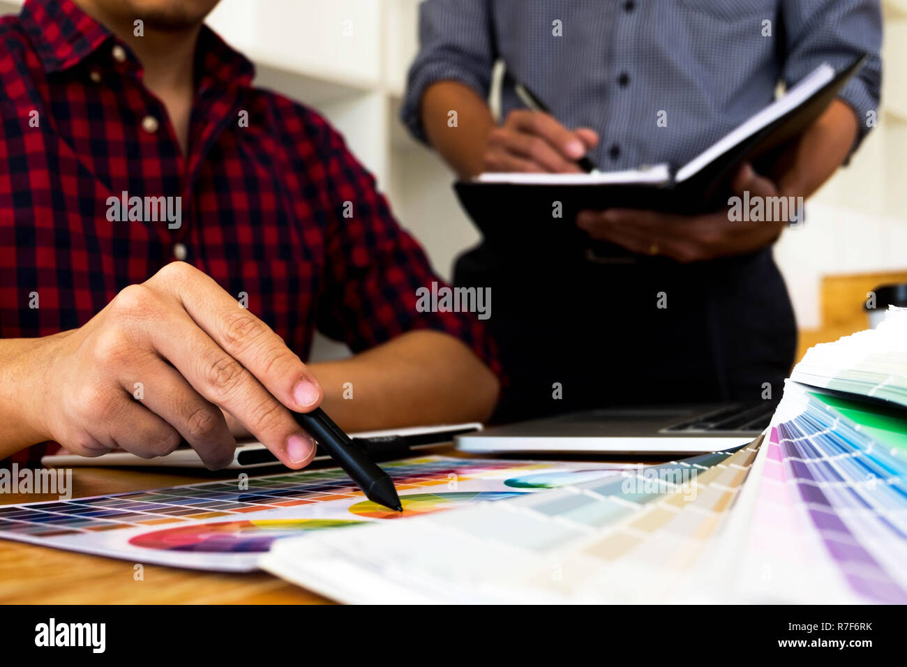 Graphic designers choose colors from the color bands samples for design ...