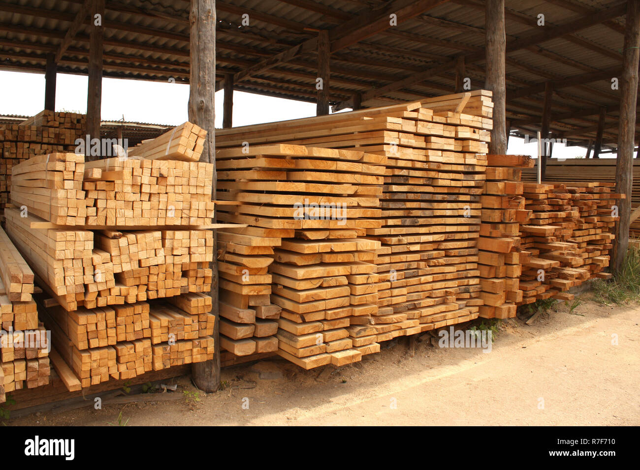 Wooden boards in a warehouse of building materials Stock Photo - Alamy