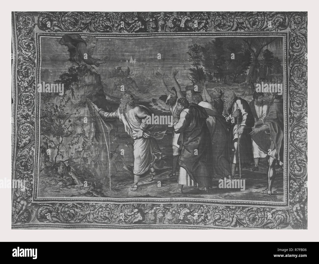 Moses striking water from rock Stock Photo - Alamy