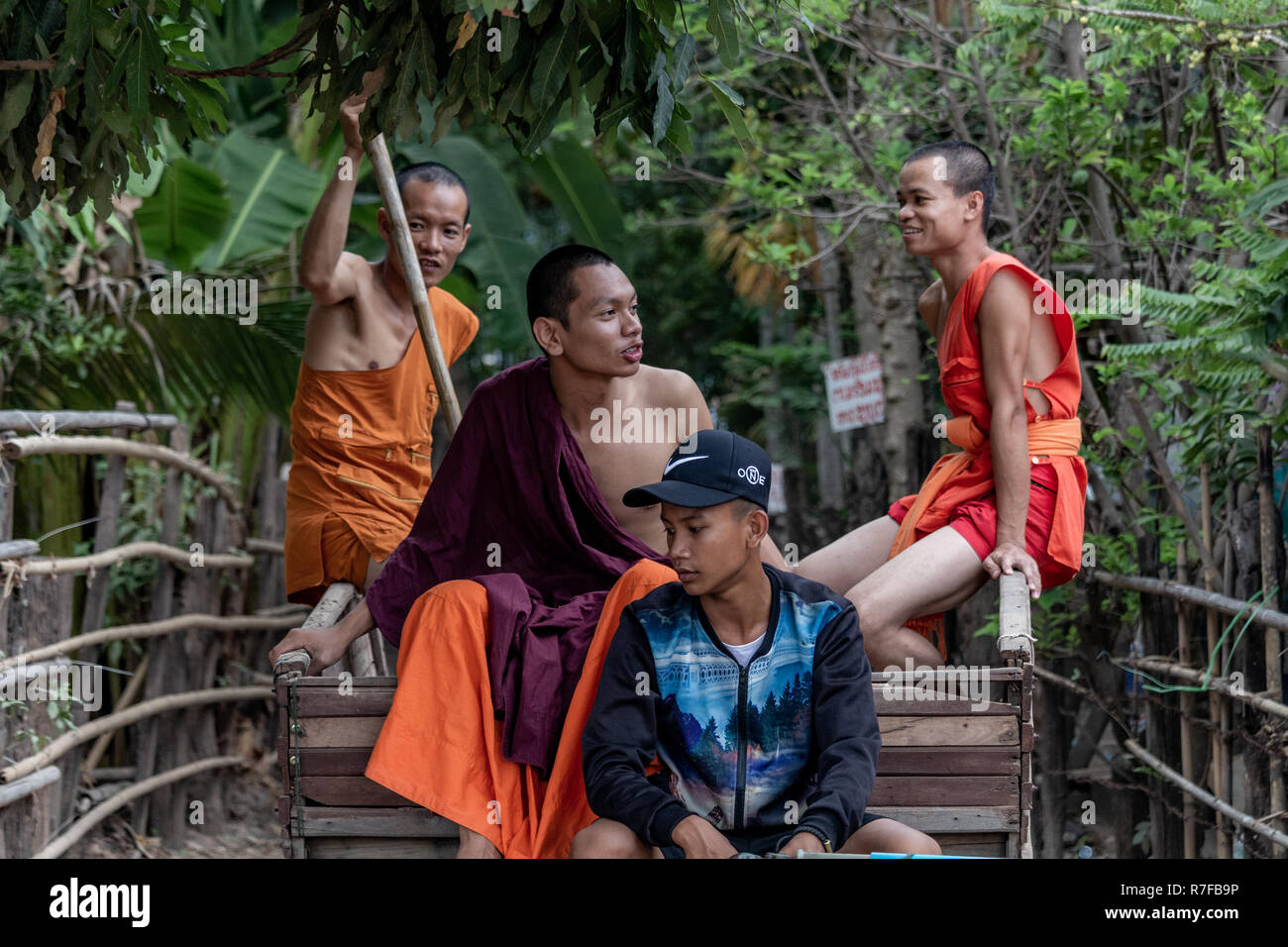 Don Daeng, Laos - April 27, 2018: Young buddhist monks sitting on a ...