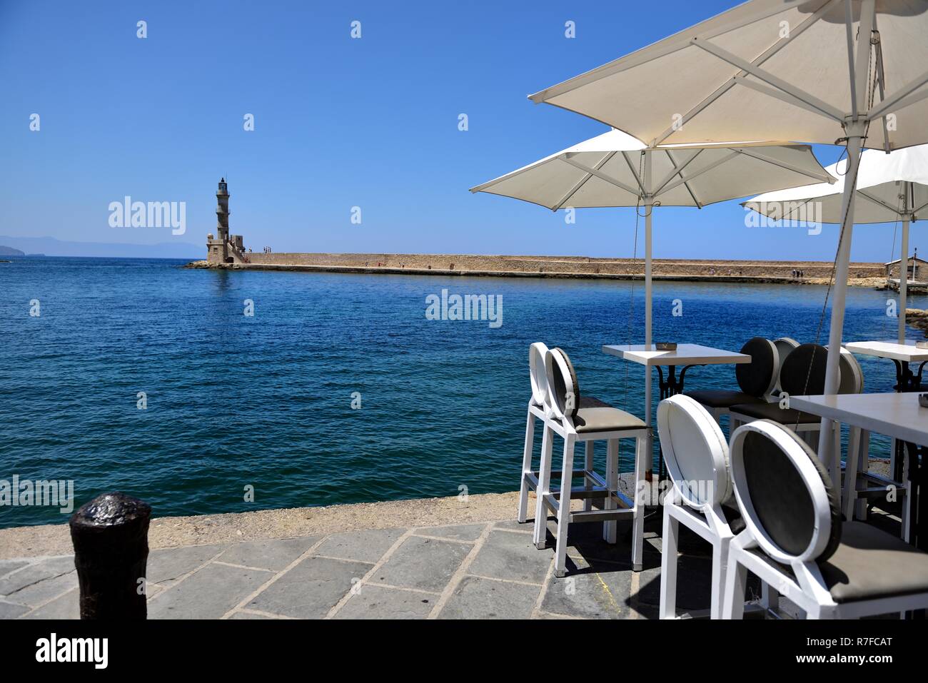 Chania, Crete - 5th July 2018:Venetian lighthouse and a restaurant of ...