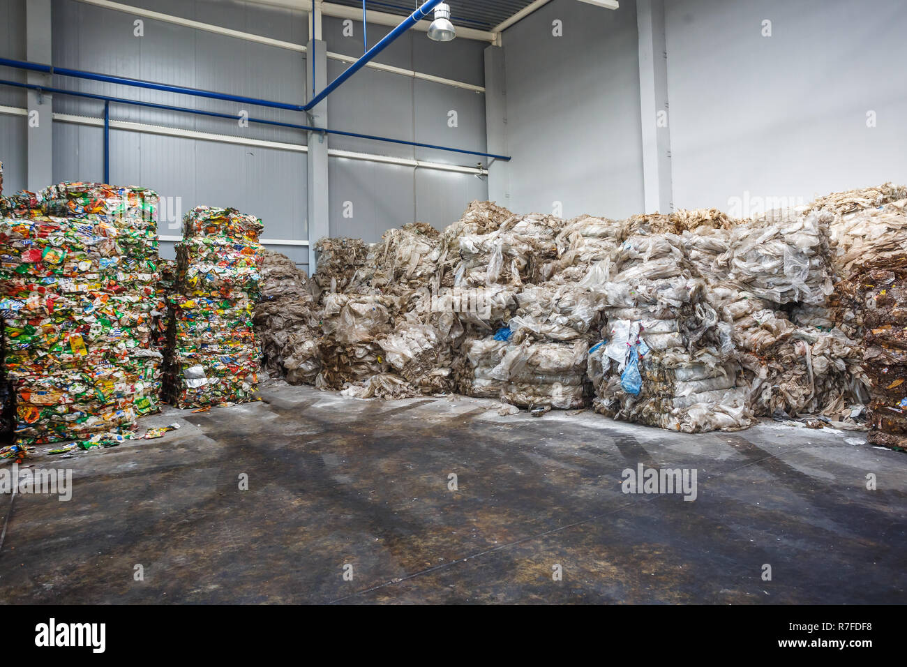 Plastic pressed polyethylene bales at finished products warehouse on ...