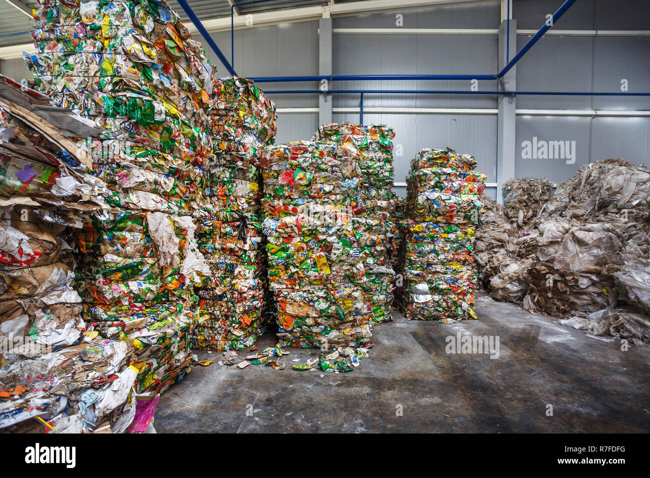 Plastic pressed polyethylene bales at finished products warehouse on ...