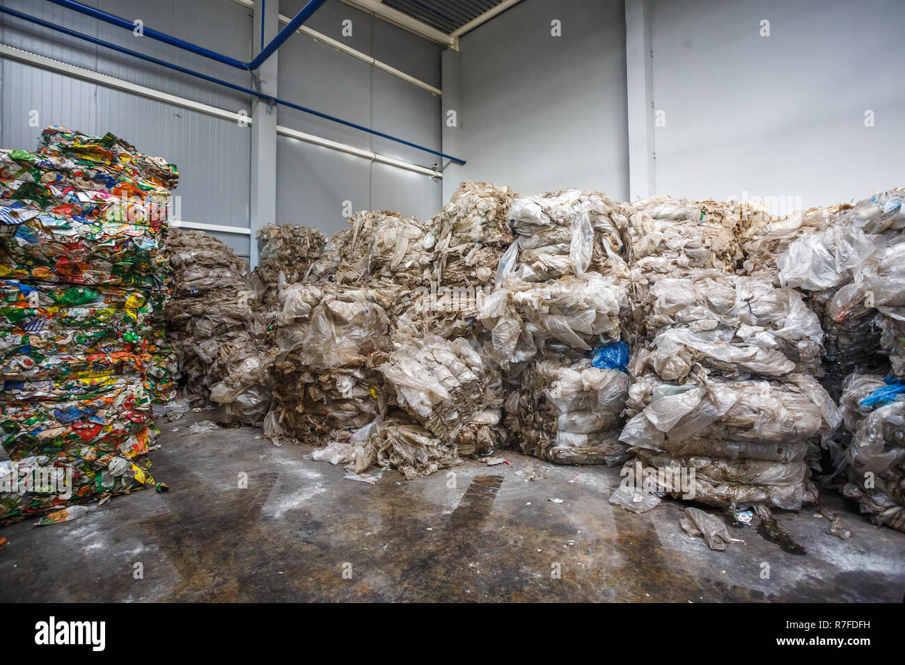 Plastic pressed polyethylene bales at finished products warehouse on ...