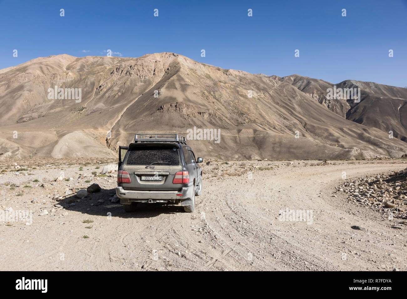 Langar, Tajikistan, August 23 2018: Off-road car is waiting on the ...