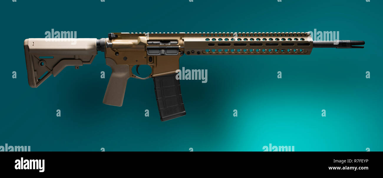 AR-15 in full length with a blue background and shadow Stock Photo - Alamy