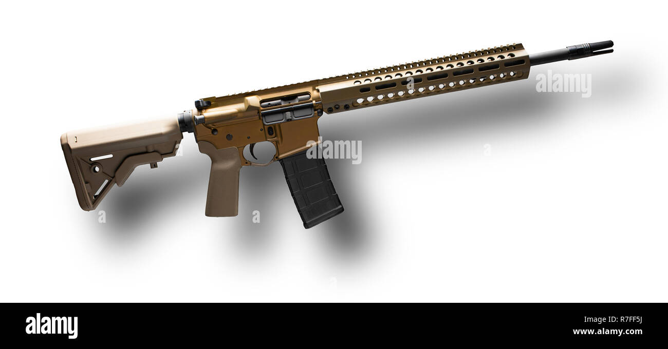 AR-15 with tan stock and pistol grip casting a shadow on a white ...