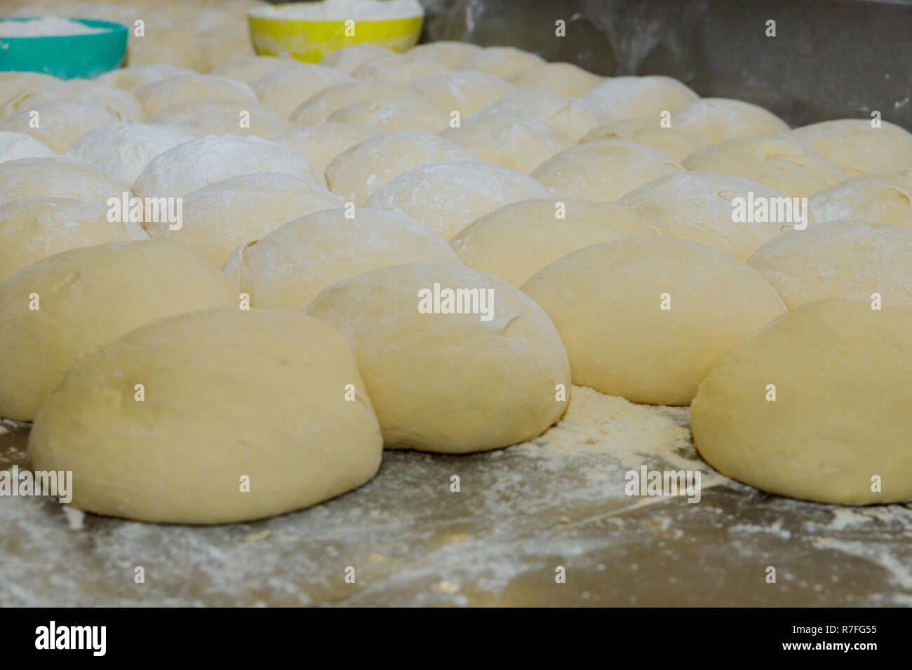 Mini bread dough on stainless steel table top Stock Photo - Alamy