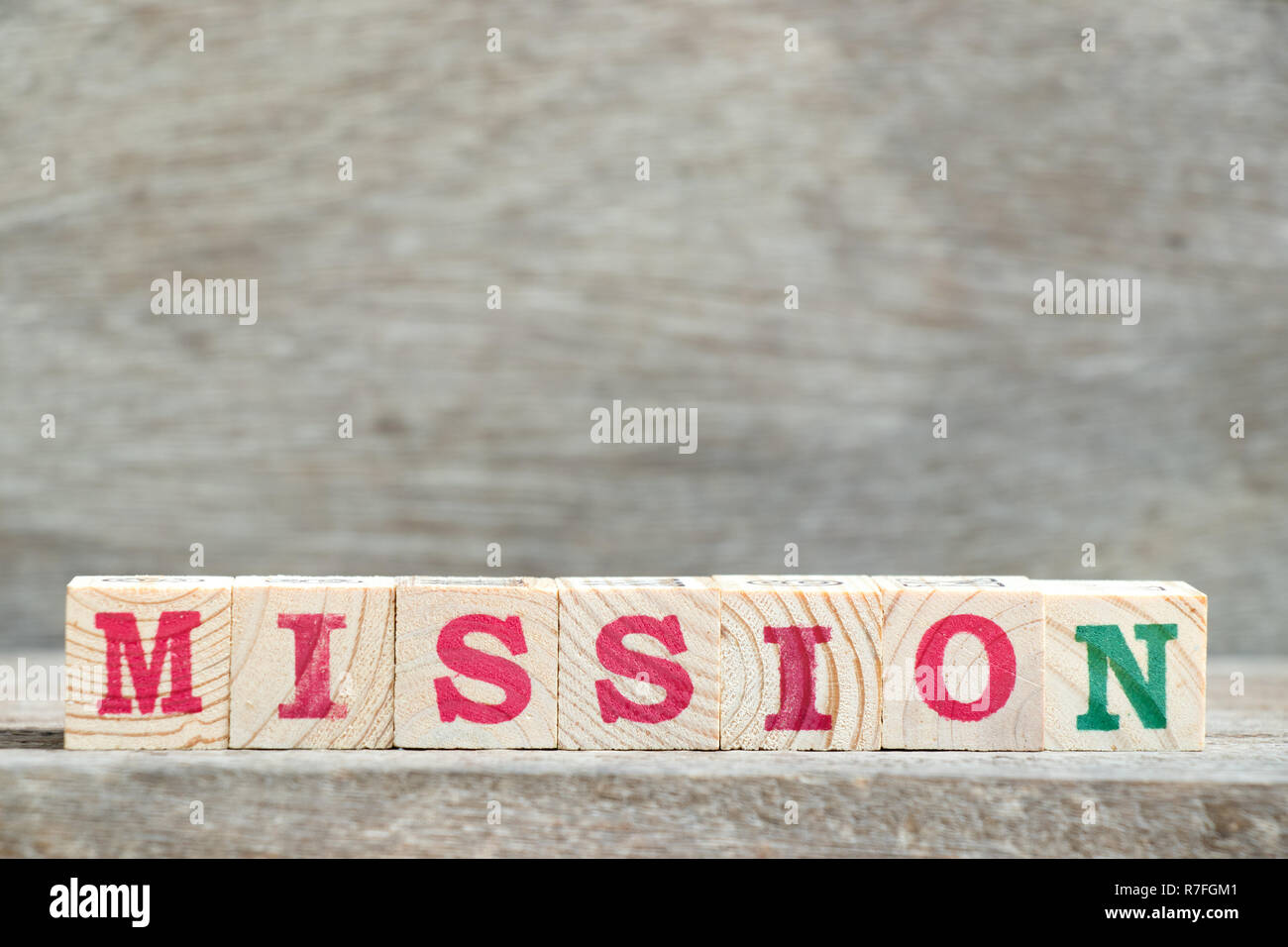 Letter block in word mission on wood background Stock Photo - Alamy