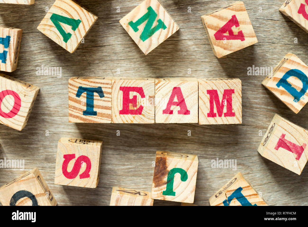 Letter block in word team with another on wood background Stock Photo ...