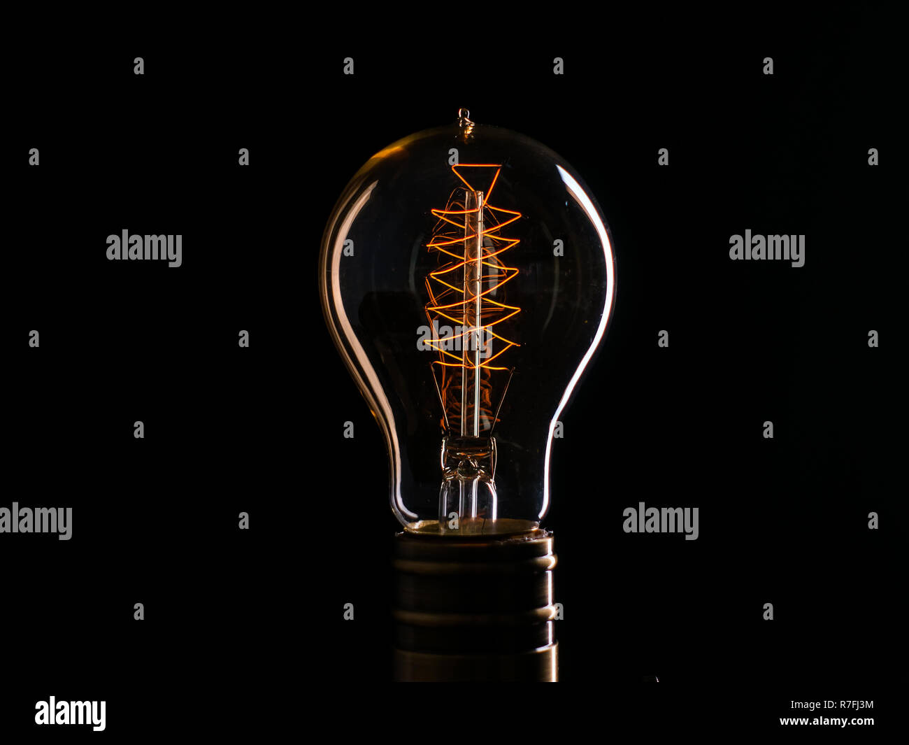 Edison's light bulb illuminates from electric current Stock Photo - Alamy